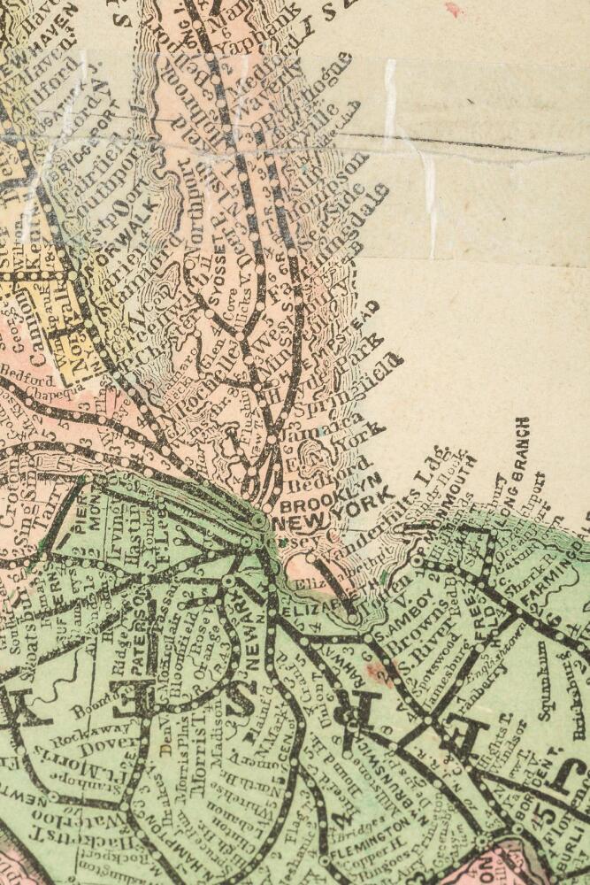 Two maps, on opposite sides of a rolling wall map